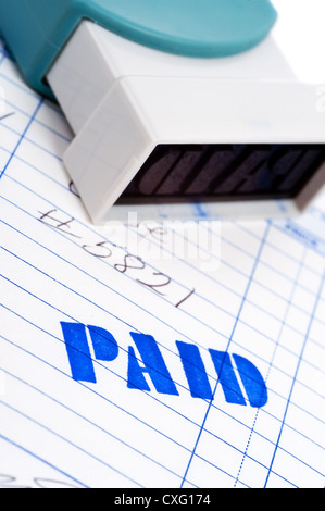 Invoice with Paid Stamp - close-up of invoice with Paid stamp, figures ...