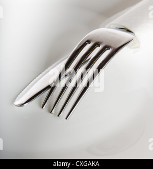 Metal fork lying on a white background. Front view Stock Photo - Alamy