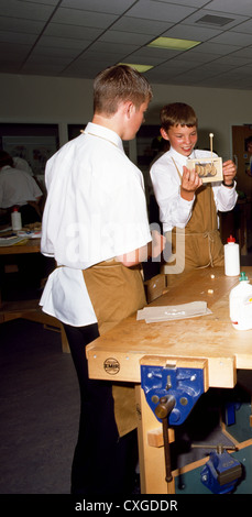 High School Woodwork Class Students Working At Bench Teacher ...