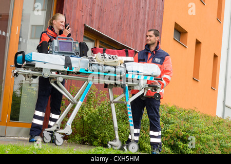Paramedics emergency home visit call radio ambulance doctor help Stock ...