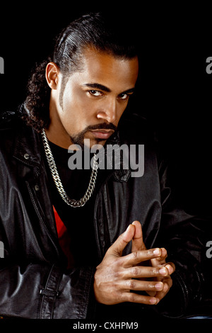 Low-key portrait - sad and angry looking man Stock Photo - Alamy