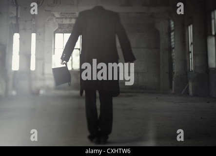 Headless man in black coat with top hat Stock Photo - Alamy