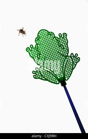 Frog shaped fly swatter on white background, close up Stock Photo - Alamy