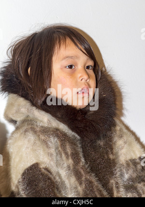Young Inuit girl in traditional skin clothing. Grise Fjord, Nunavut ...
