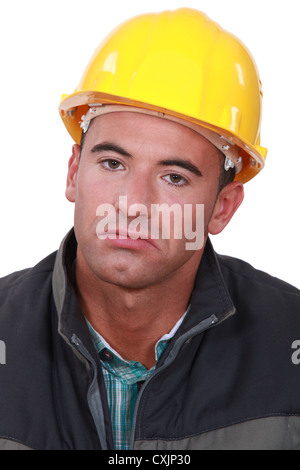 Grumpy manual worker Stock Photo - Alamy
