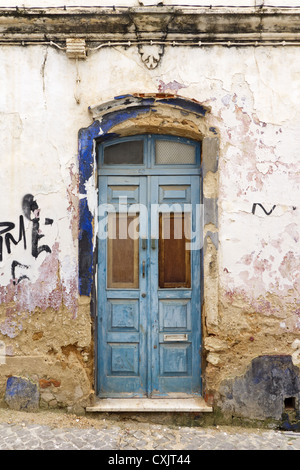 Old rotten front wooden door with blue peeling paint Stock Photo - Alamy