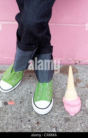 Girl with ice cream cone in front of hedge Stock Photo - Alamy