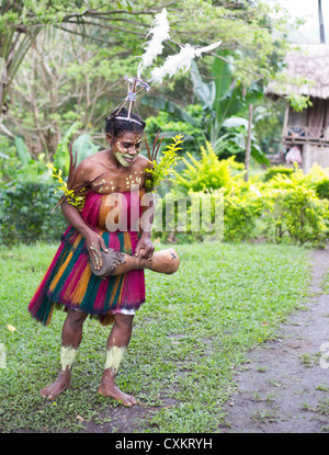 Woman wearing tribal dress and headdress made of moss at the singsing ...