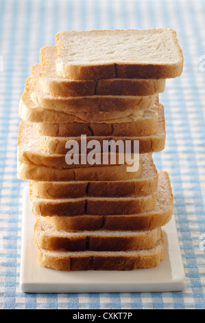 Loaves of brown bread stacked up and ready for breakfast Stock Photo ...
