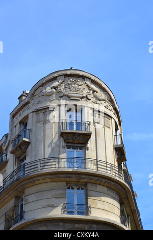 Elegant corner building with classical architecture against a clear ...
