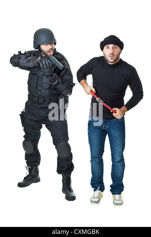 a scared burglar busted by a swat or police officer Stock Photo - Alamy