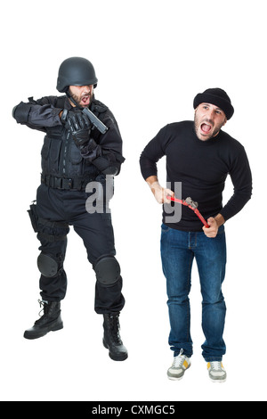 a scared burglar busted by a swat or police officer Stock Photo - Alamy