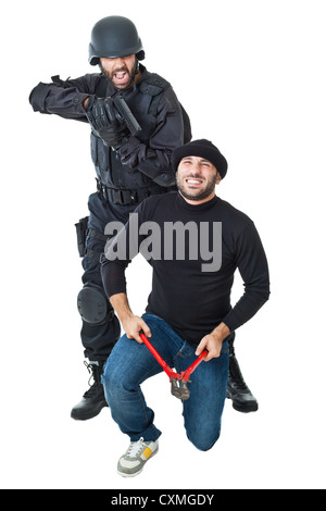 a scared burglar busted by a swat or police officer Stock Photo - Alamy