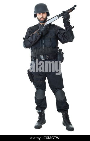 a swat agent wearing a bulletproof vest and aiming with a gun Stock ...