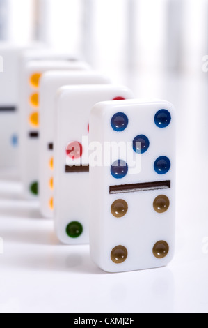 Color dominoes on a white background Stock Photo - Alamy
