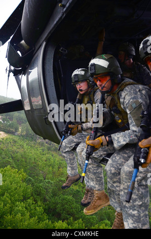 U.S. Army Special Forces (USSF) raid a mock hostile compound under the ...