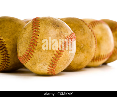 a background of vintage, antique, old baseballs on a white background ...