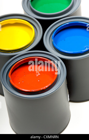 Four primary colored cans of paint on white background Stock Photo - Alamy