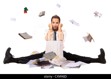 Businessman doing splits with office trash Stock Photo - Alamy