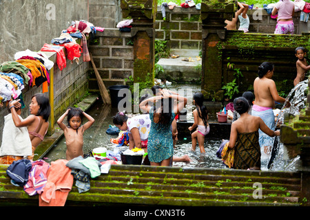 Mother child poor Bali poverty challenged extreme hold feed poor bellow ...