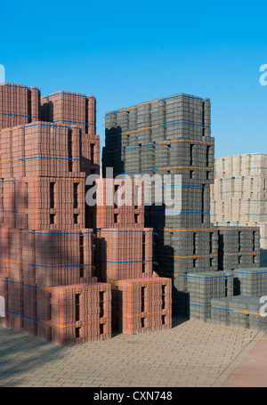 highly piled up bricks ready for transport Stock Photo - Alamy