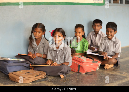 Indian school children writing in their notebooks Andhra Pradesh Stock ...