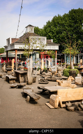 Small shopping mall with outdoor sculpture and café seating main street ...