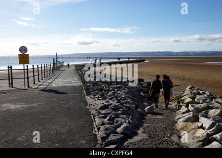 River Dee estuary with Marine Lake with painted warning signs on ...