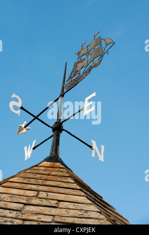 Wind vane on roof Stock Photo - Alamy