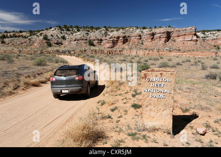 Car on a dirt road, Notom-Bullfrog Road, Capitol Reef National Park ...