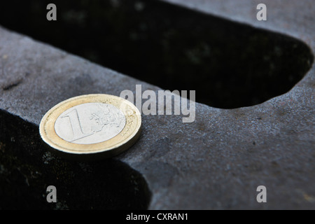 Euro coin, drain Stock Photo - Alamy