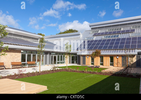 Building solar panels. Solar elementary school building. Eco-friendly ...