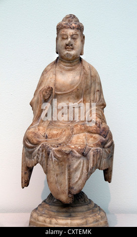 A Tang Dynasty marble sculpture of a Buddhist disciple is seen on ...