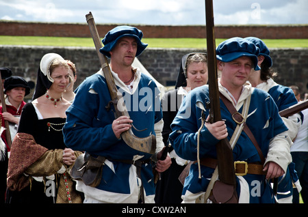 Men in medieval Scottish military dress at an historic event at Fort ...