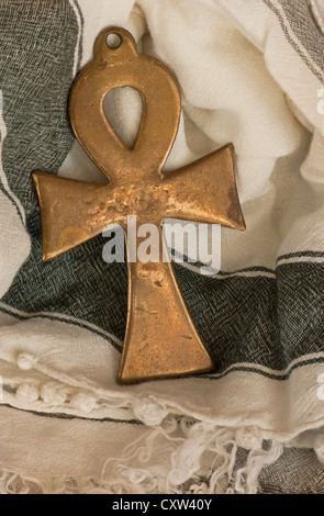 Ankh, an ancient Egyptian symbol of life, in ahand of a god on the wall ...
