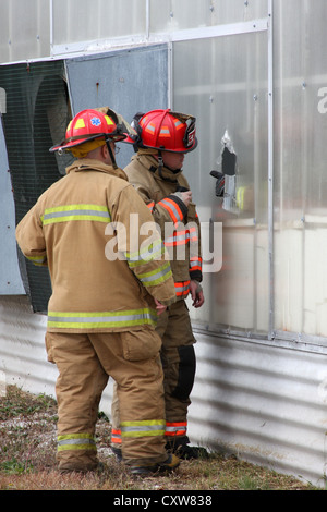 Firefighters communicating at a fire scene Stock Photo - Alamy