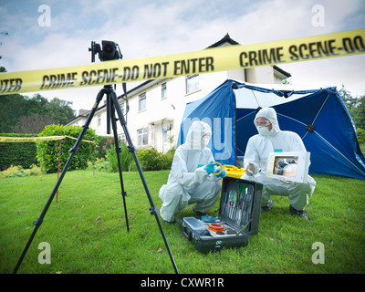 Crime scene investigation, forensic people at a murder scene. Police work, preservation of ...