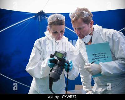 Forensic crime scene evidence showing glowing fingerprints on lethal ...