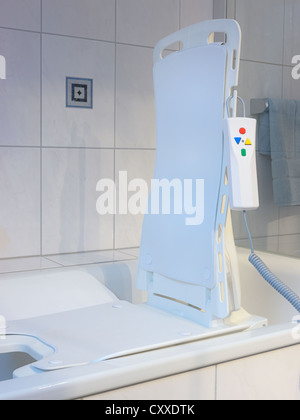 Battery-powered bath lift with an electric motor and a remote control ...