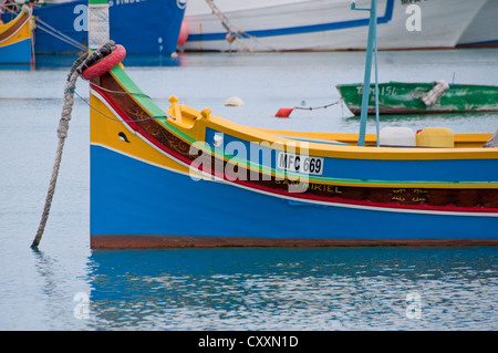 Bow of fishing boat with evil eye decoration in the harbour of ...