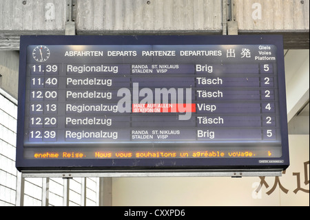 Train destination board with departure times and platform number, and ...