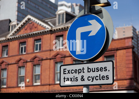 A road sign showing a compulsory right turn but with restrictions Stock ...