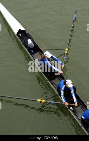 Team of rowing Four-oar women in boat Stock Photo - Alamy