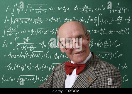 Professor, teacher, blackboard, mathematic formulas, equations ...