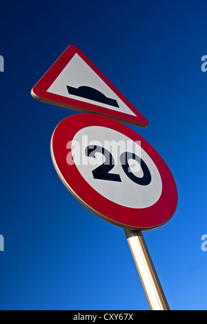 20 kph speed limit and speed bumps signs Stock Photo - Alamy