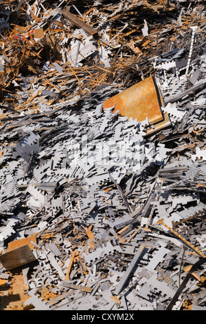 Assorted white and rusted metal brackets at a scrap metal recycling ...