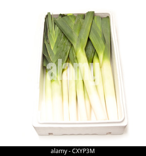 Box of leeks on white background Stock Photo - Alamy