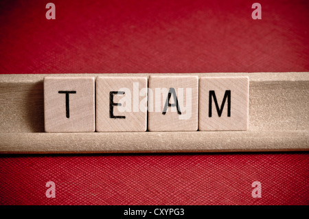 team spelled with scrabble tiles Stock Photo - Alamy