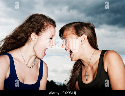 two teenage girls shouting at each other Stock Photo - Alamy