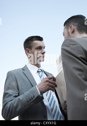 businessman gives a bribe Stock Photo - Alamy